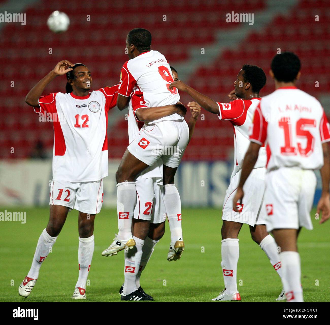 Omani players celebrate their victory against Malaysia during their ...