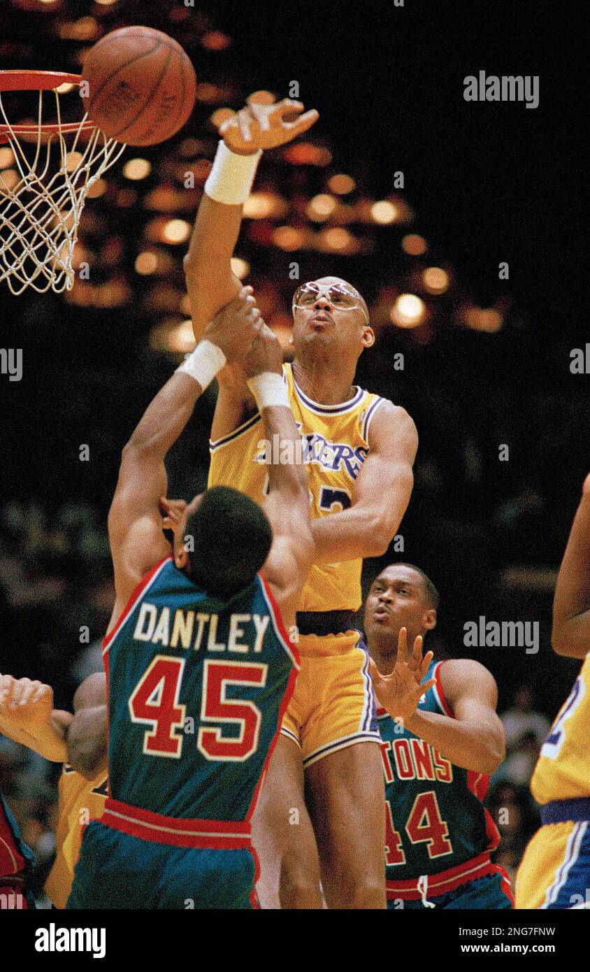 Kareem Abdul-jabbr, of the Los Angeles Lakers bats the ball away from ...