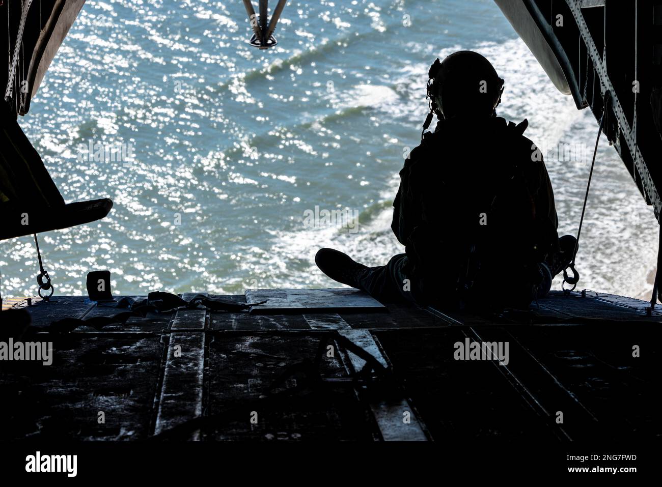 A U.S. Marine with Marine Medium Tiltrotor Squadron 162, scans the ...