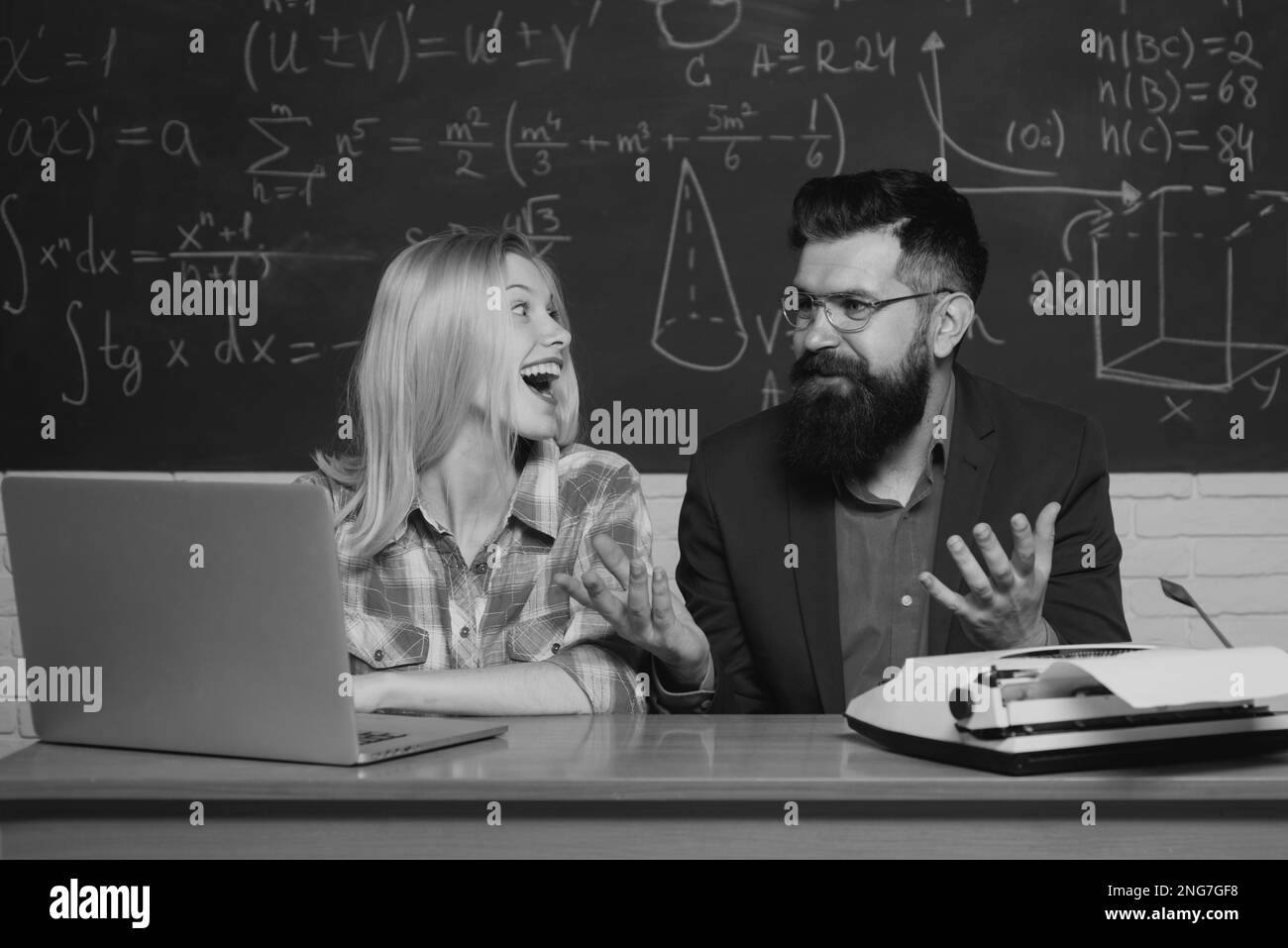 Back to school. Teachers day. Male home tutor helping girl with studies ...