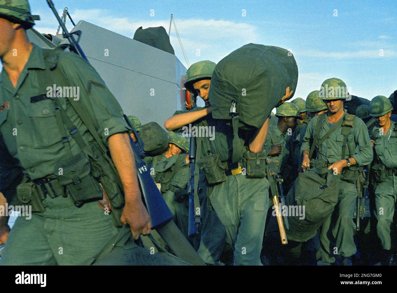 Soldiers from US 199th Light Infantry Brigade unload from landing boats ...