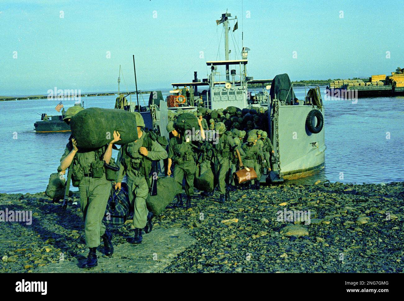 Soldiers from US 199th Light Infantry Brigade unload from landing boats ...