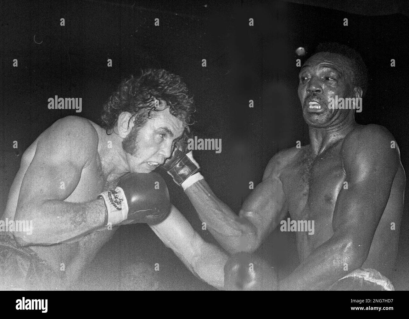American Bob Foster, right, throws a punch at Britain's Chris Finnegan ...