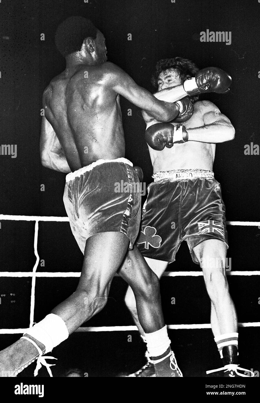 American Bob Foster, left, throws a punch at Britain's Chris Finnegan ...