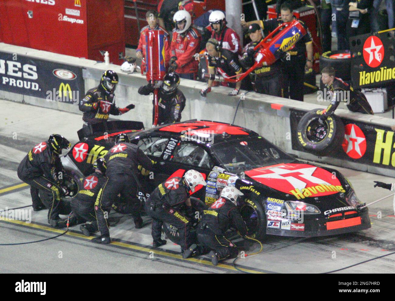 Busch Series driver Juan Pablo Montoya has his car serviced during the ...