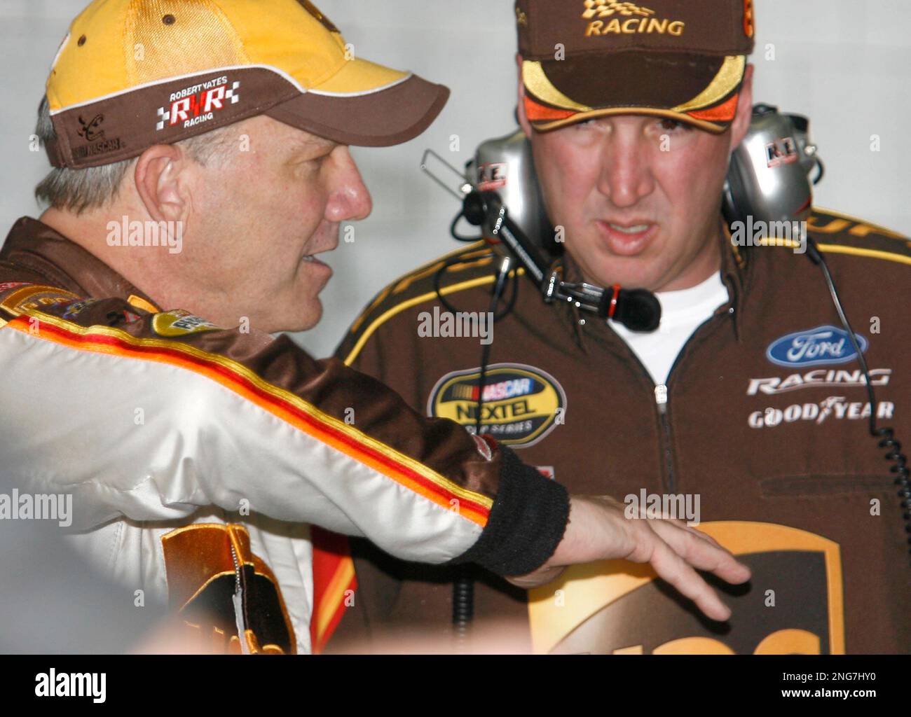 NASCAR driver Dale Jarrett, left, talks with members of his pit crew at ...