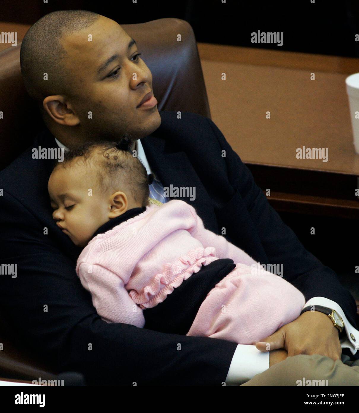 Oklahoma state Rep. T.W. Shannon, R-Lawton, holds his sleeping 14-month ...