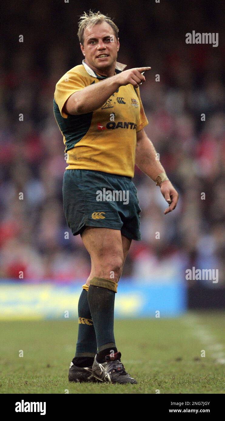 Australia's captain Phil Waugh gestures to teammates as they play Wales ...