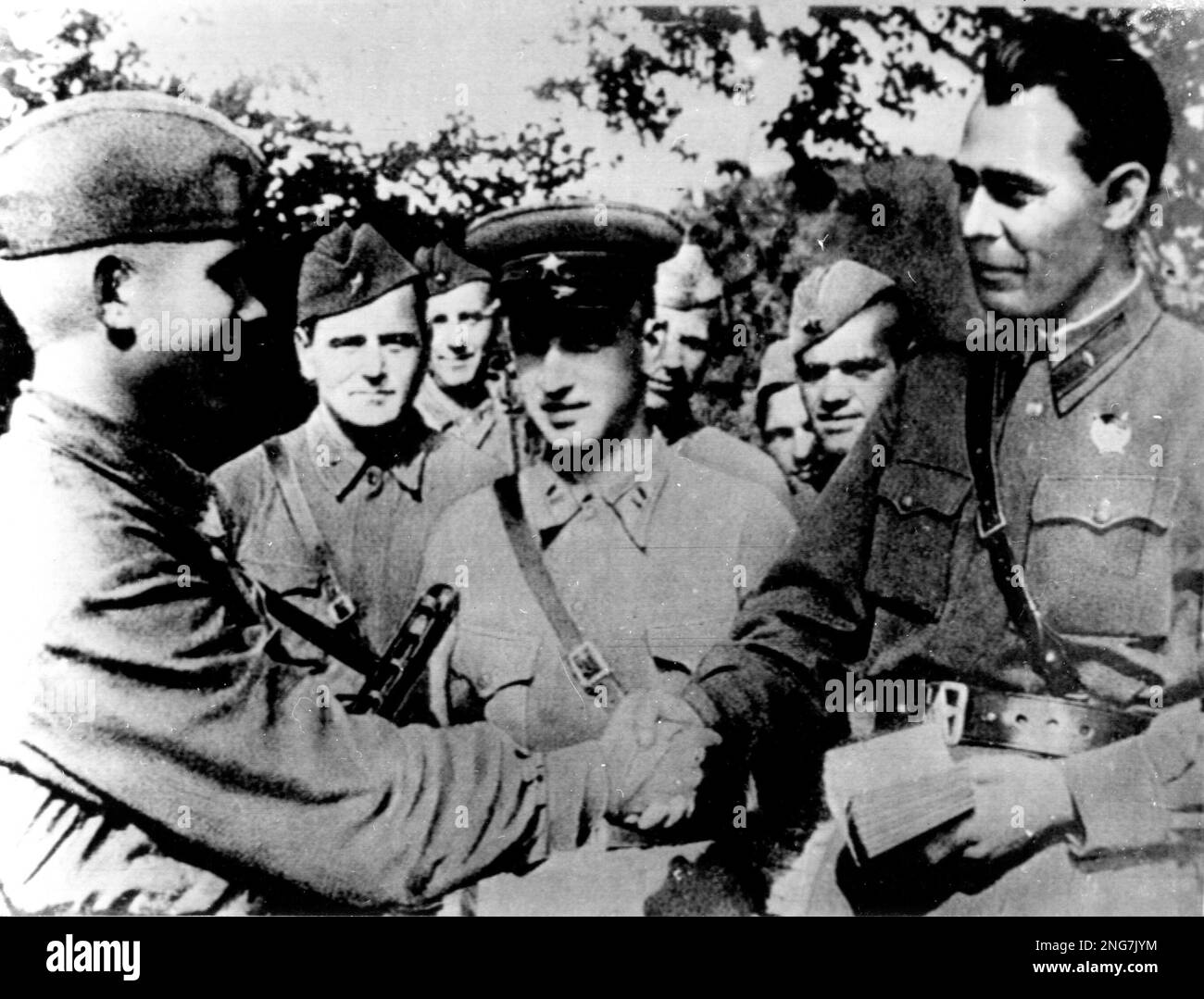 Brigade Commisioner Leonid Brezhnev, right, is pictured as he hands ...