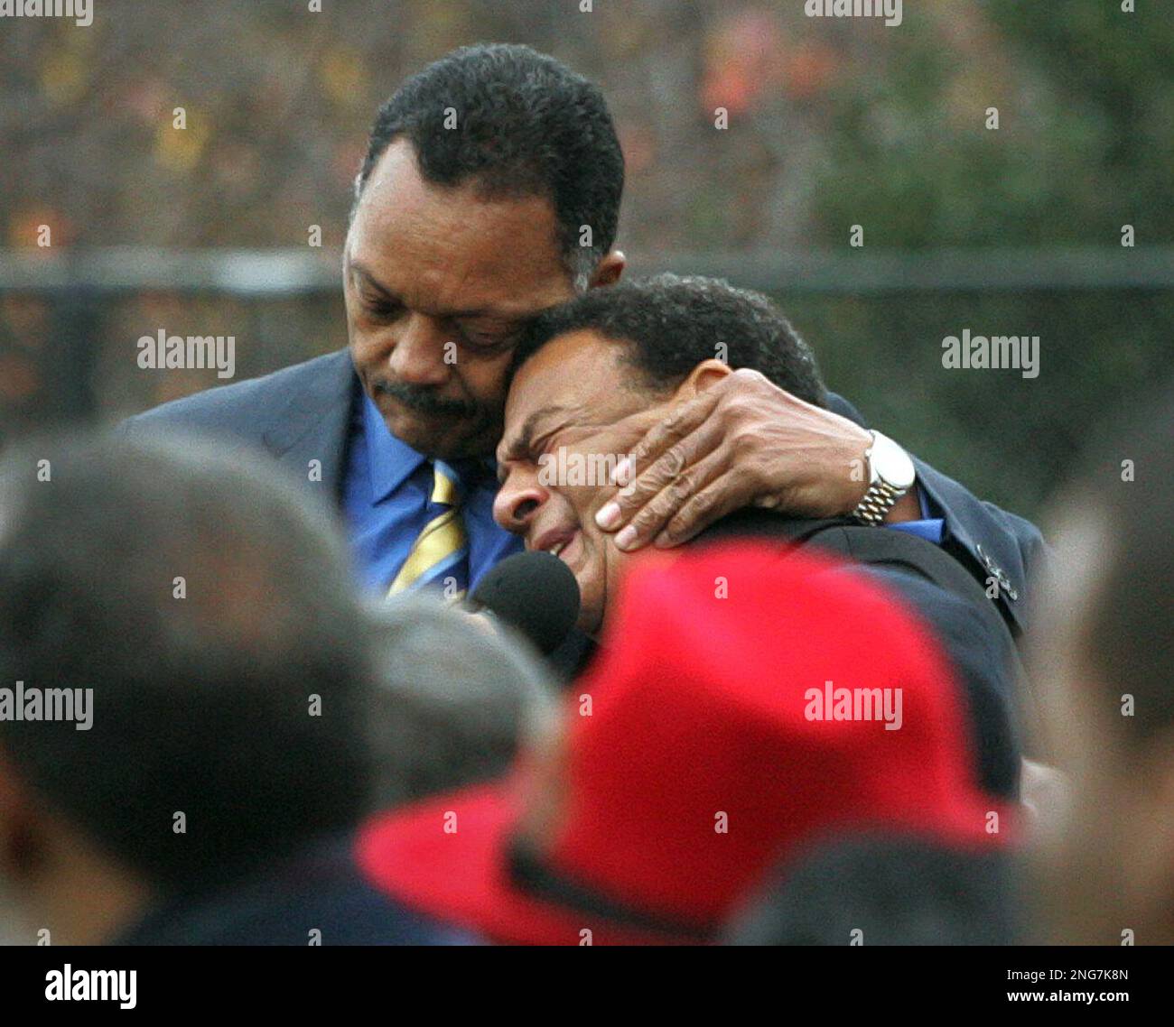 Rev. Jesse Jackson comforts former U.N. Ambassador Andrew Young, right ...