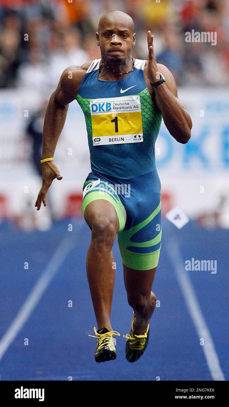 ** FILE ** Asafa Powell from Jamaica on his way to win the Men's 100 ...