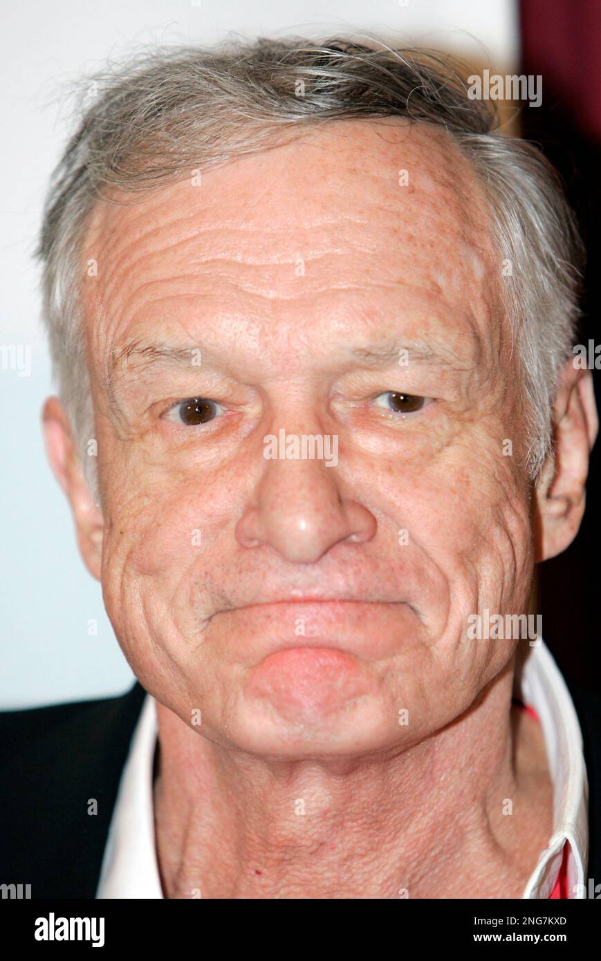 Hugh Hefner poses as he arrives at Singers and Songs Celebrate Tony ...