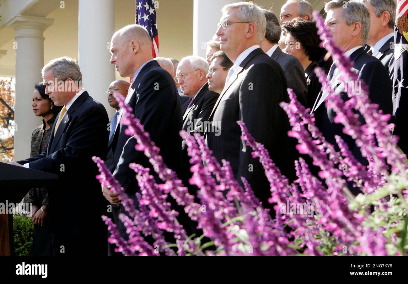 President Bush, second from the left, speaks to members of the media in ...