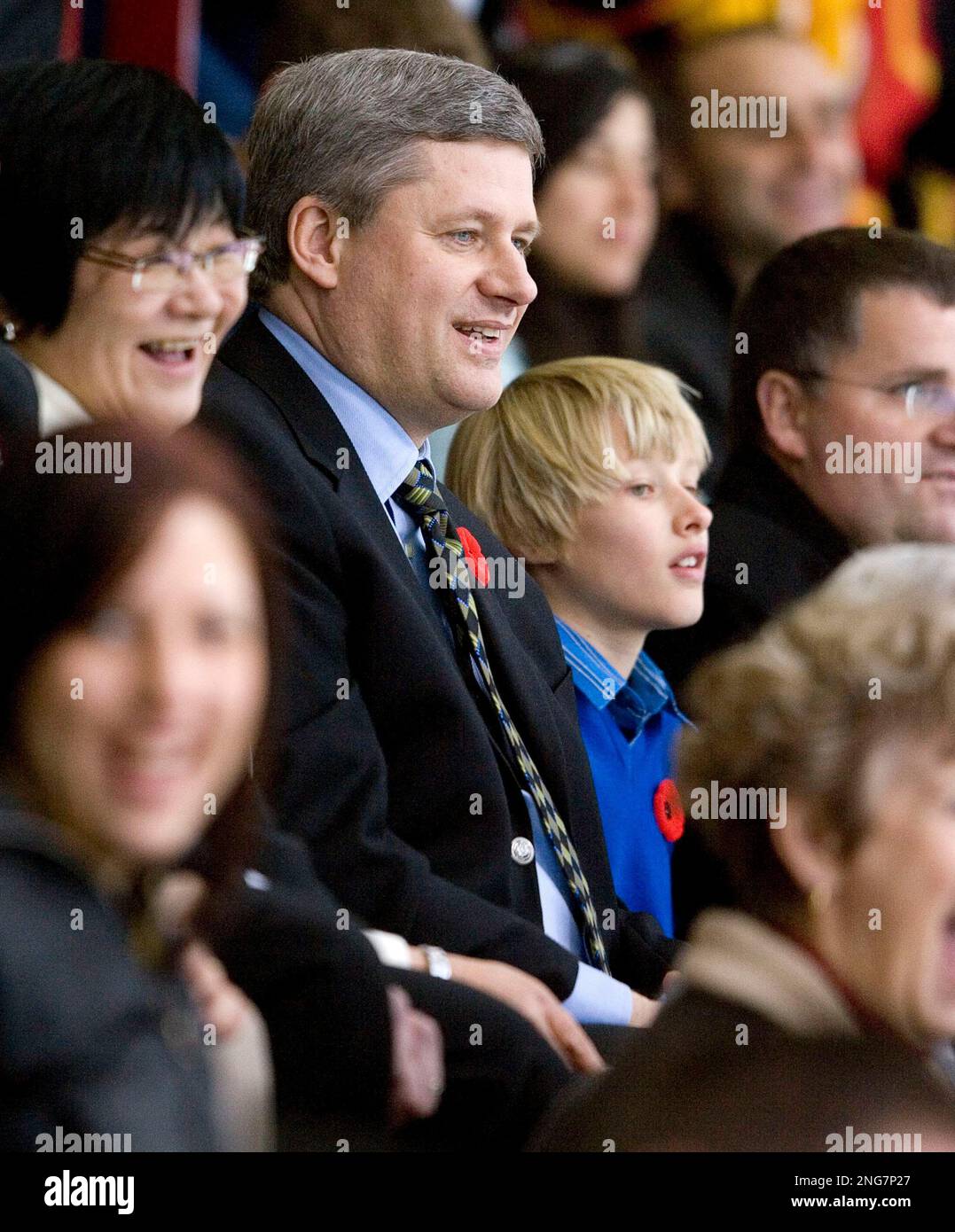 Canada's Prime Minister Stephen Harper and his son Ben watch the NHL ...