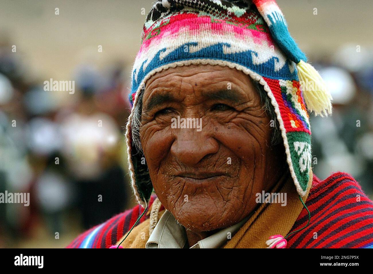An Aymara Indian wears his traditional dress at the torch-lighting ...