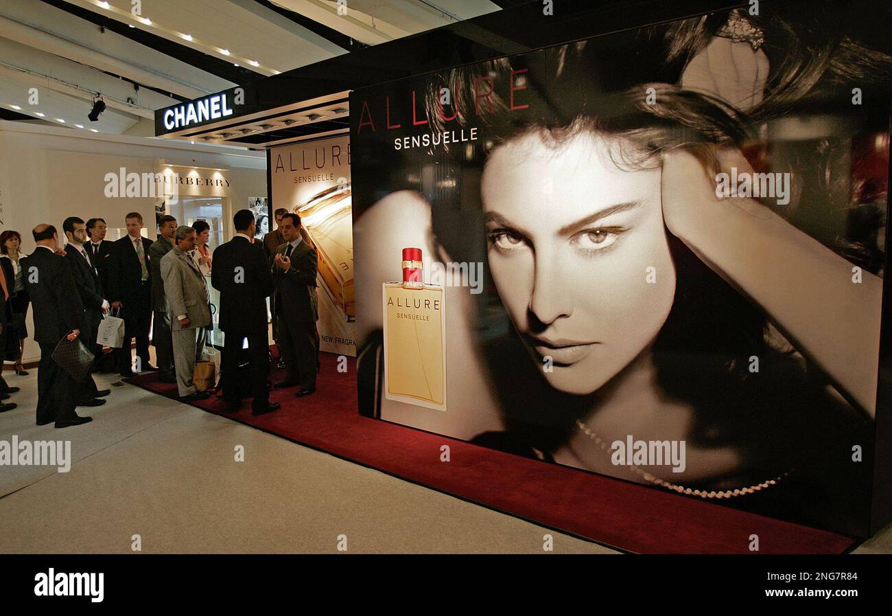 Visitors are seen in front of a stand in the TFWA (tax free world ...