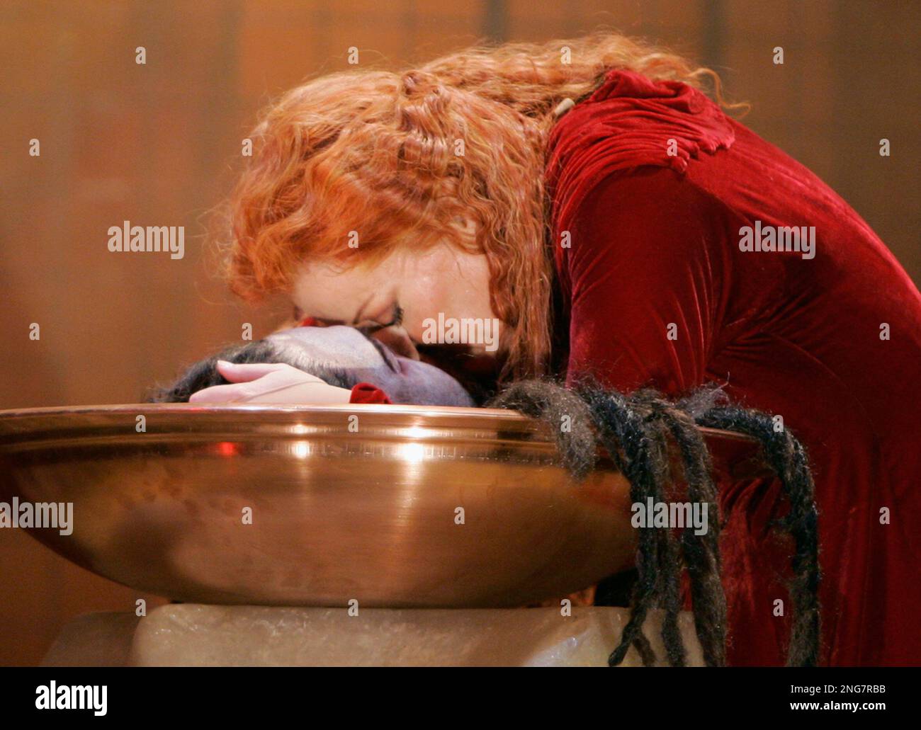 Soprano Deborah Voigt as Salome kisses the severed head of John the ...