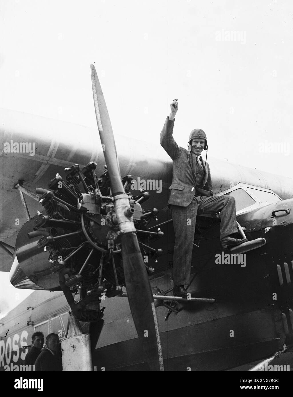Captain Charles Kingsford-Smith waves to friends at Croydon Airport ...