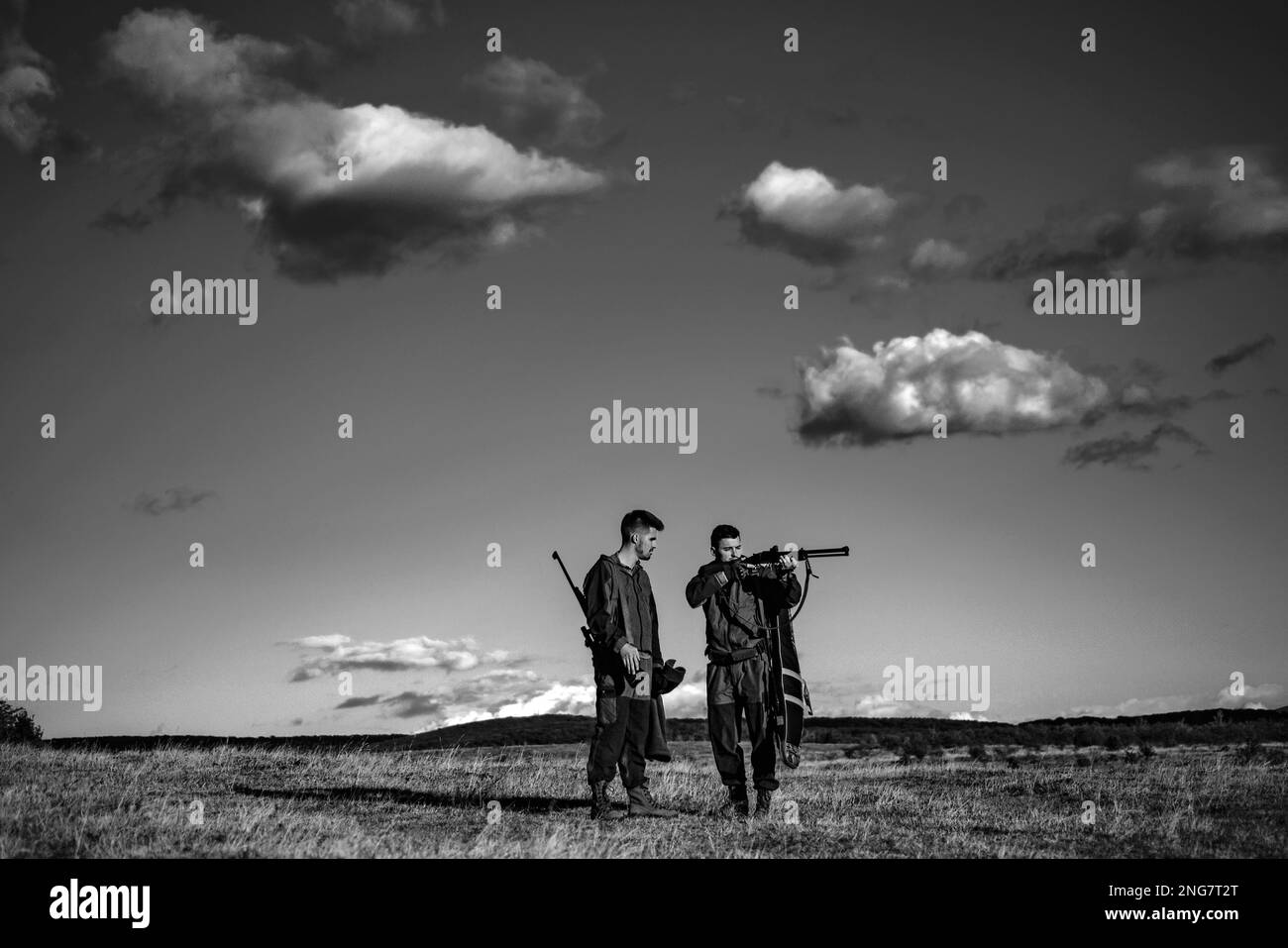 Hunters with shotgun gun on hunt. hunter man holding gun and walking in ...