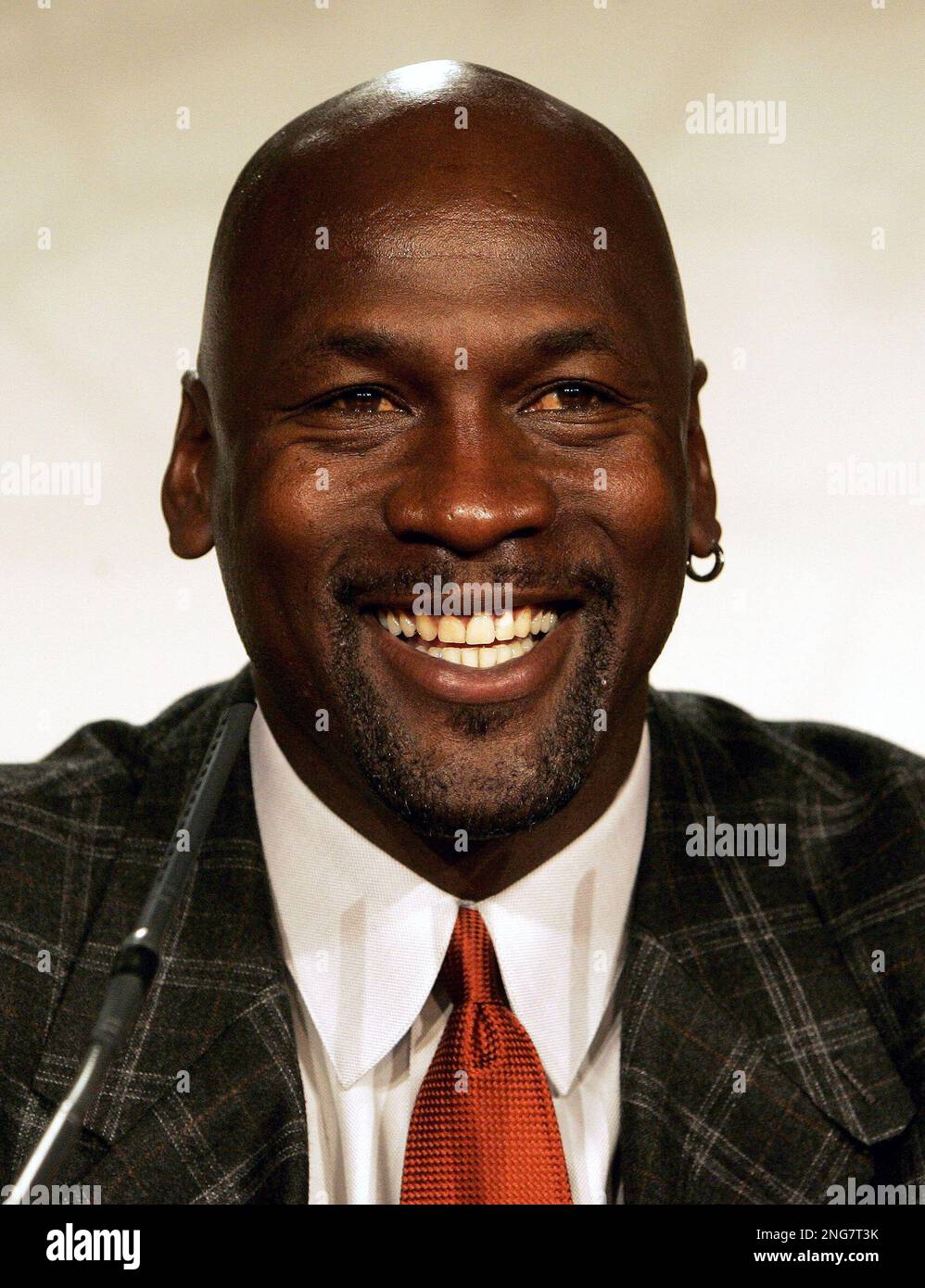 Former U.S. basketball player Michael Jordan, smiles during a press ...
