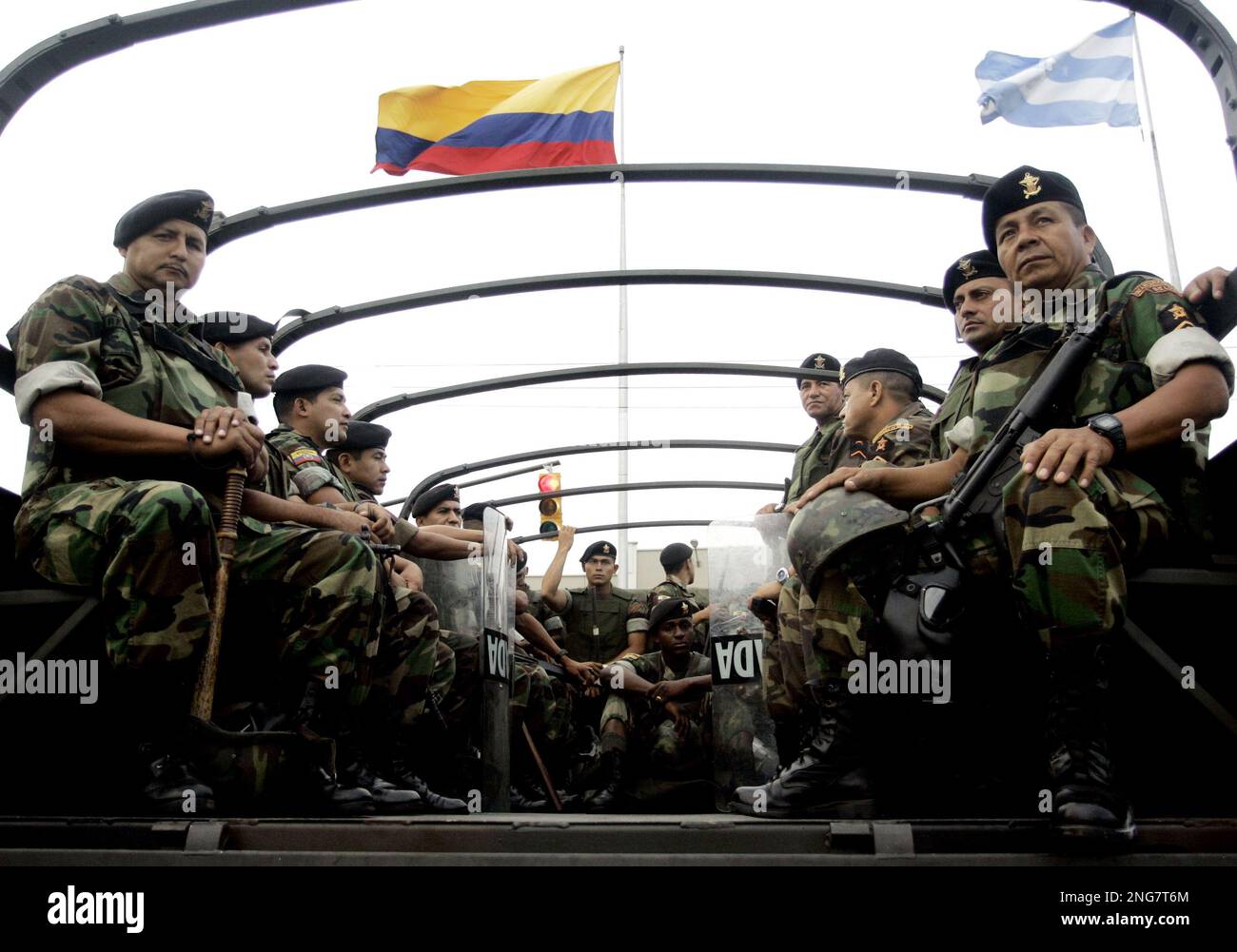 Ecuadorean Army soldiers patrol the street on a truck during ...