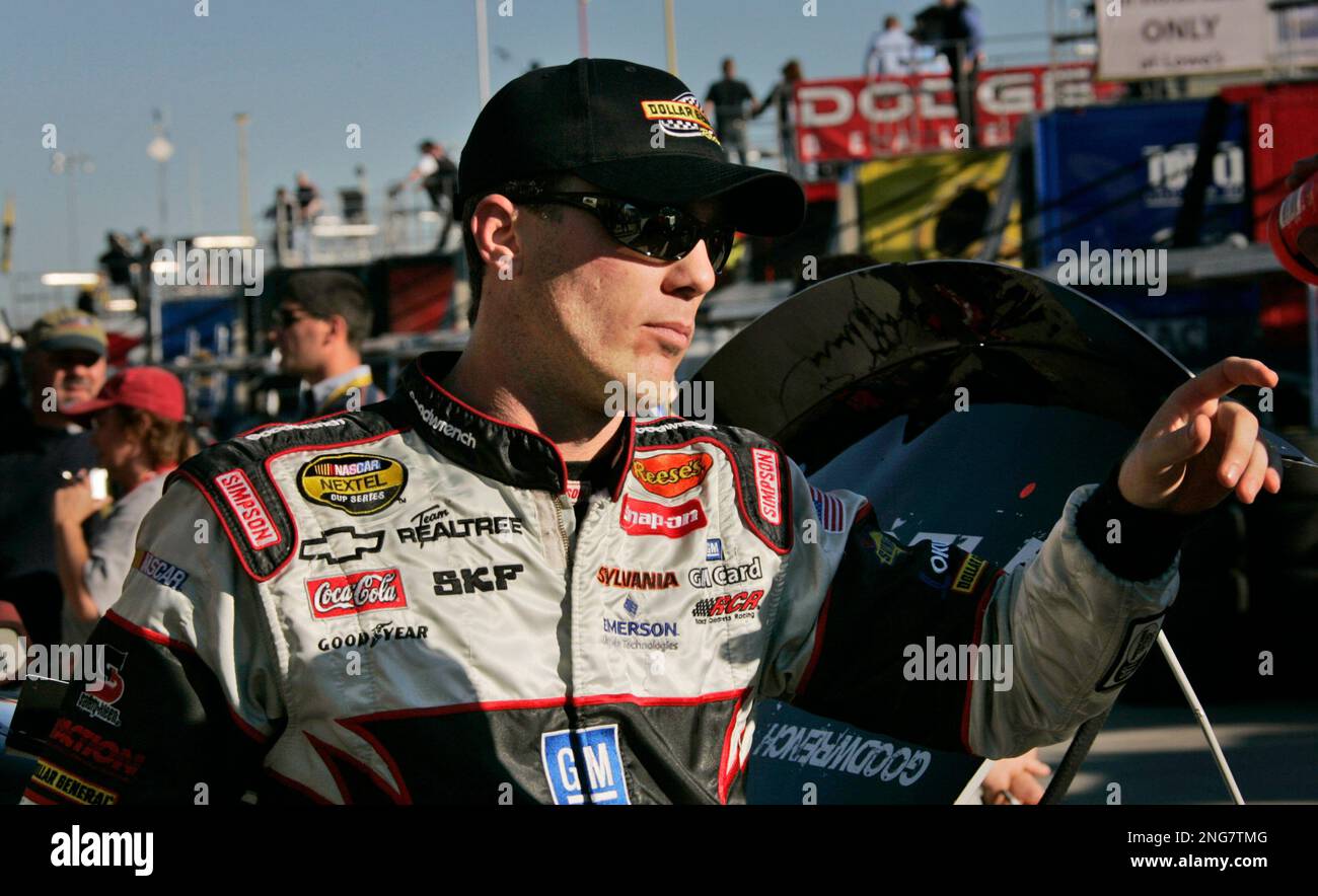 NASCAR driver Kevin Harvick walks through the garage area during ...