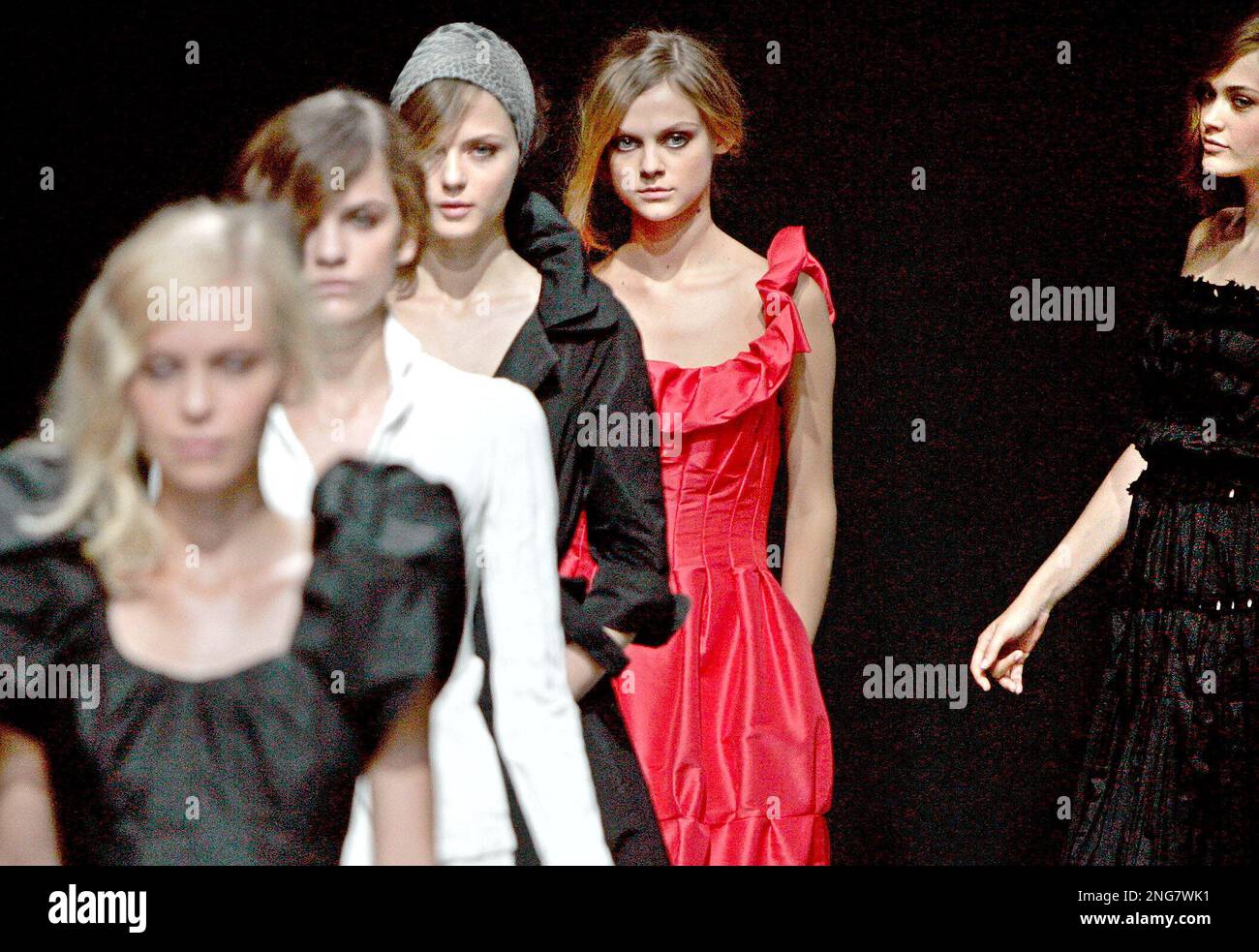 Models presents an ensemble designed by Japanese fashion designer Yuki ...