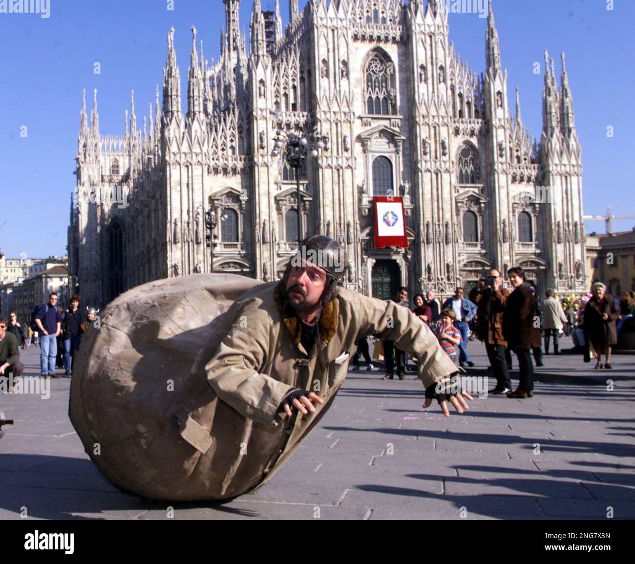 A man dressed as a "cannon ball" in Milan' Duomo square Thursday, March ...