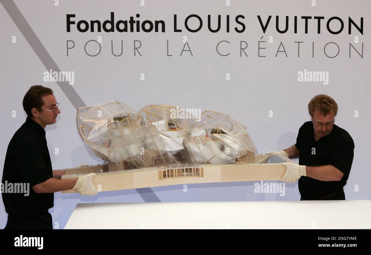 French luxury-goods Moet Hennessy Louis Vuitton (LVMH) employees carry ...