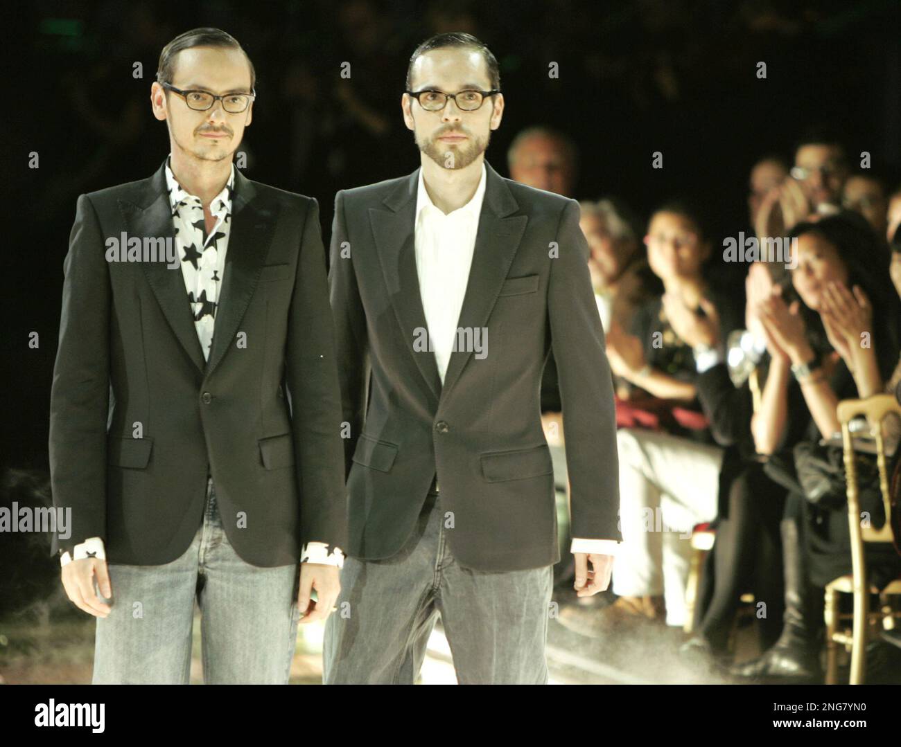 Dutch fashion designers Viktor, left, and Rolf, right, acknowledge ...