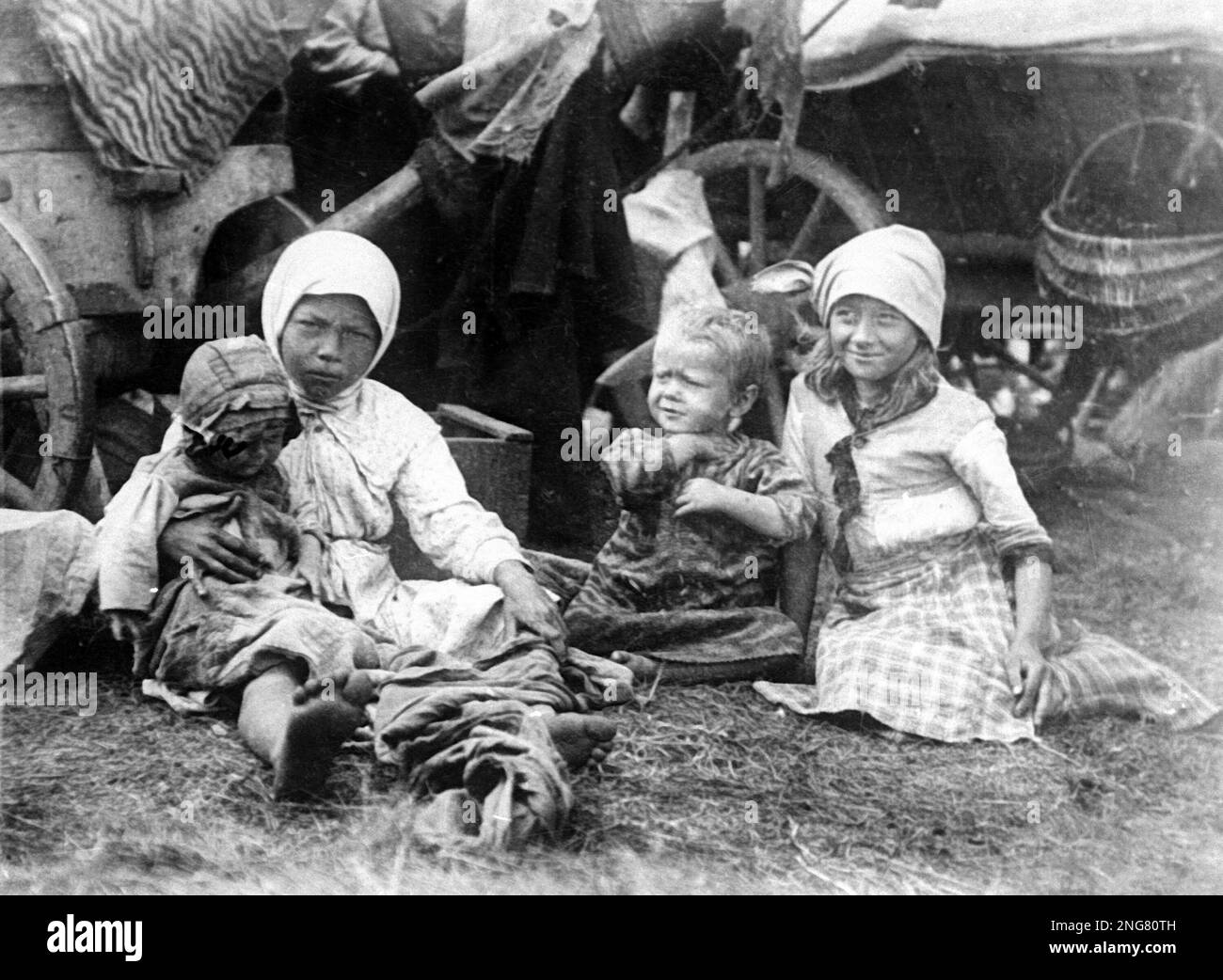 Small children, victims of the Russian famine, are seen seated on the ground, 1921. (AP Photo ...