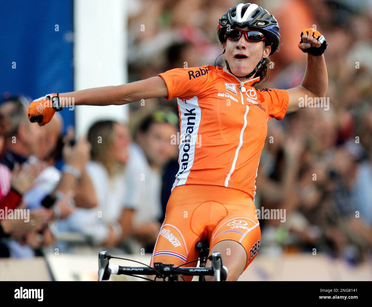 Marianne Vos of the Netherlands celebrates as she crosses the finish ...