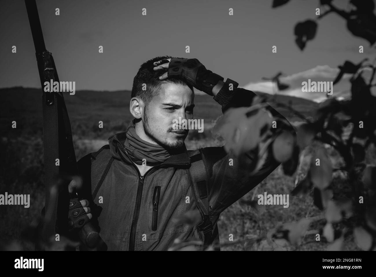 Hunter with shotgun gun on hunt. Mountain hunting. Portrait of hamdsome ...