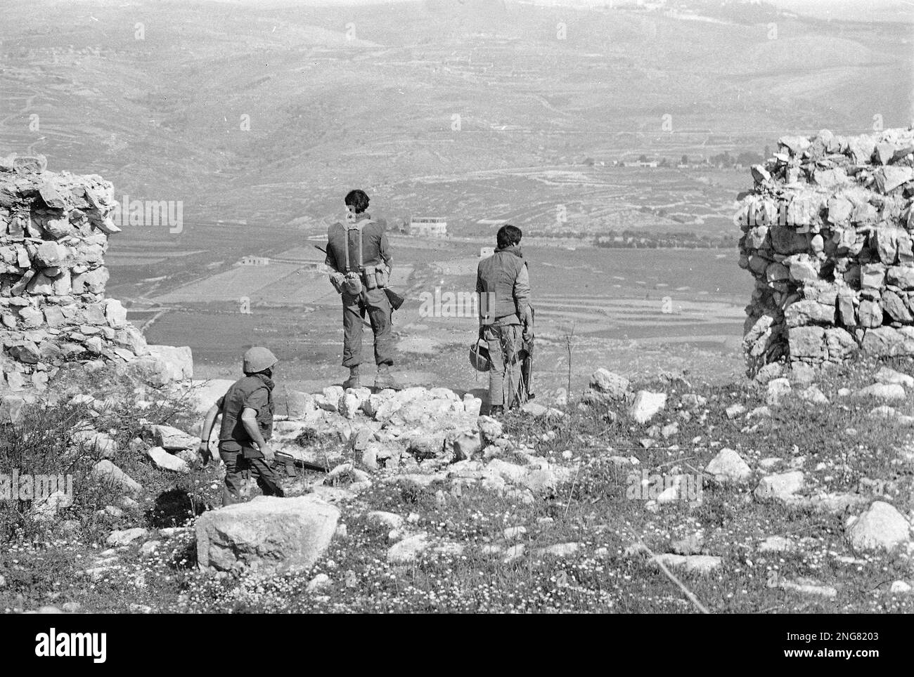 Three Israeli soldiers stand atop the Crusaders' Ancient Fortress next ...