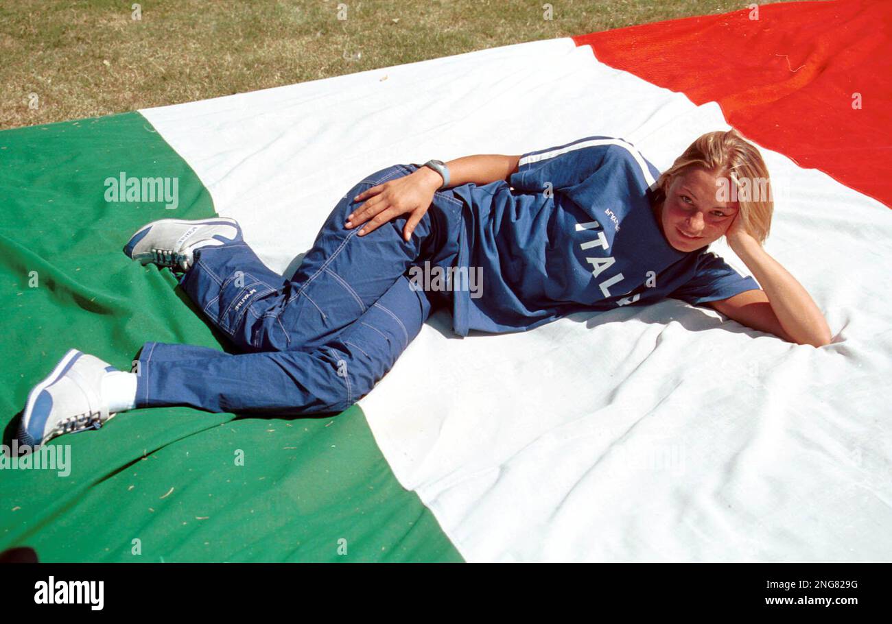 Italian volleyball player Maurizia Cacciatori poses on the Italian flag ...