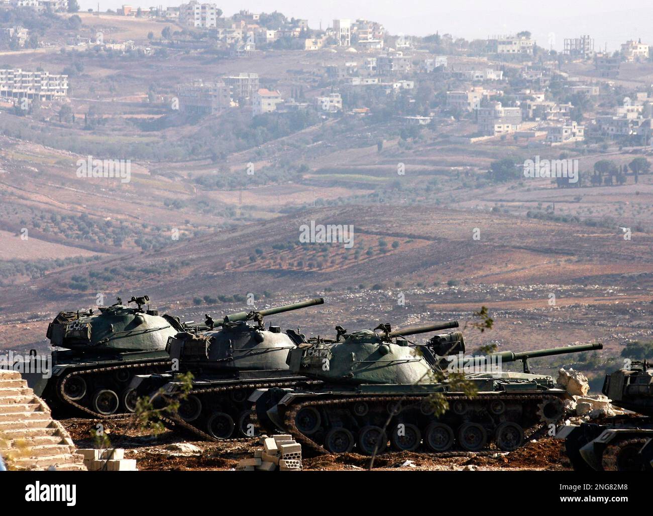 Lebanese military tanks sit on a hill in a Lebanese army base in the ...