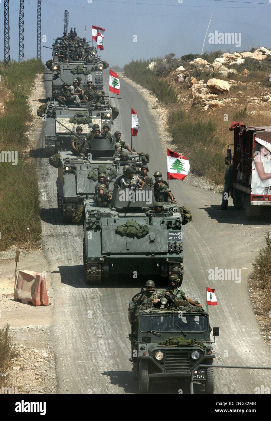 Lebanese soldiers atop M113 armored personnel carriers travel in convoy ...