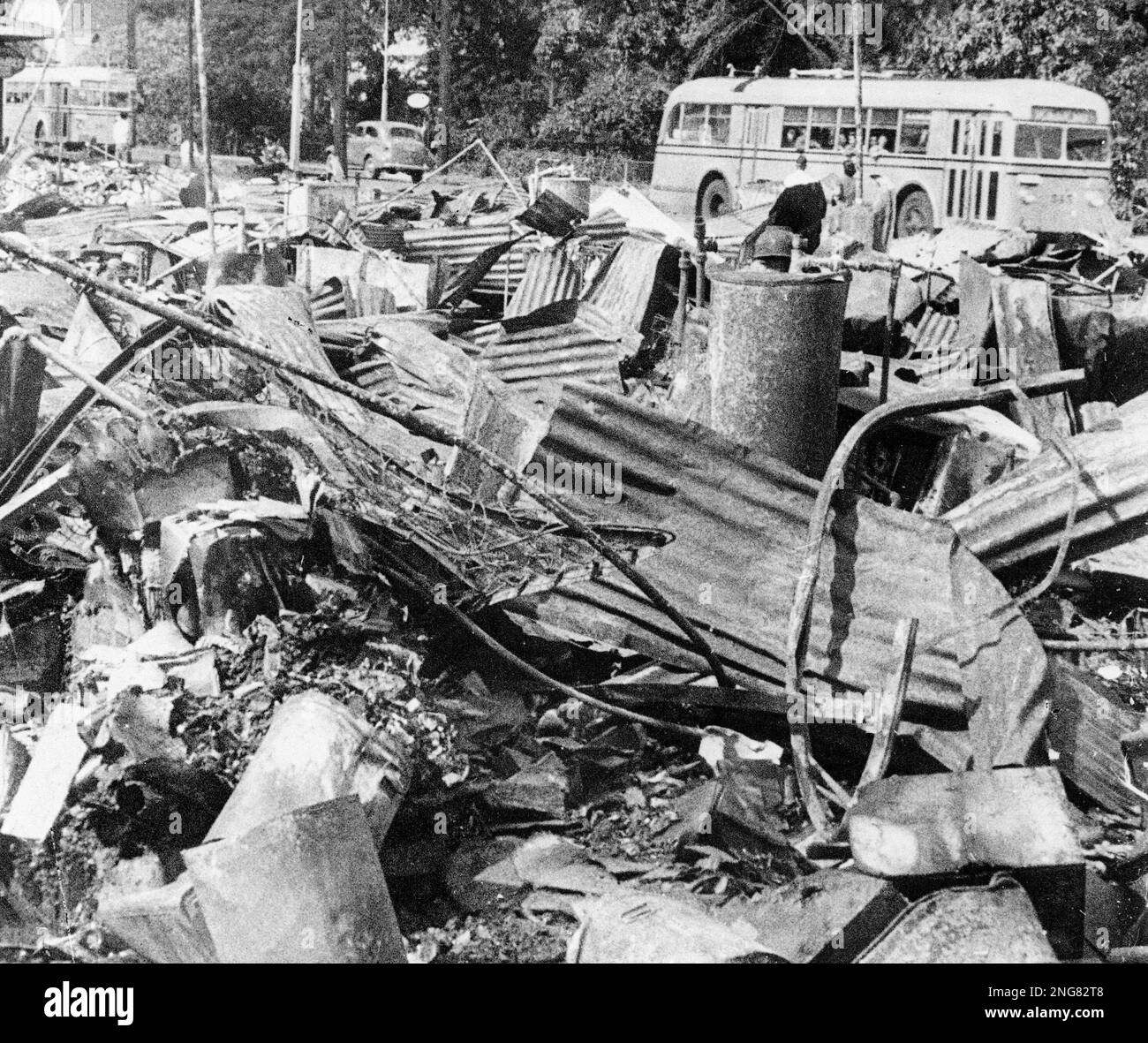 A mass of twisted metal wreckage lay along a Honolulu street after the ...