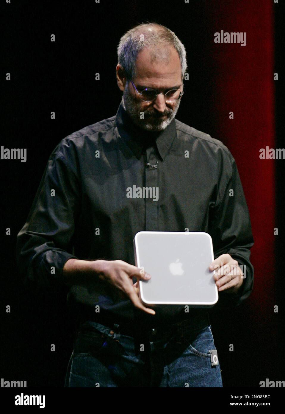 Apple Computer CEO Steve Jobs shows off the new iTV during announcement ...