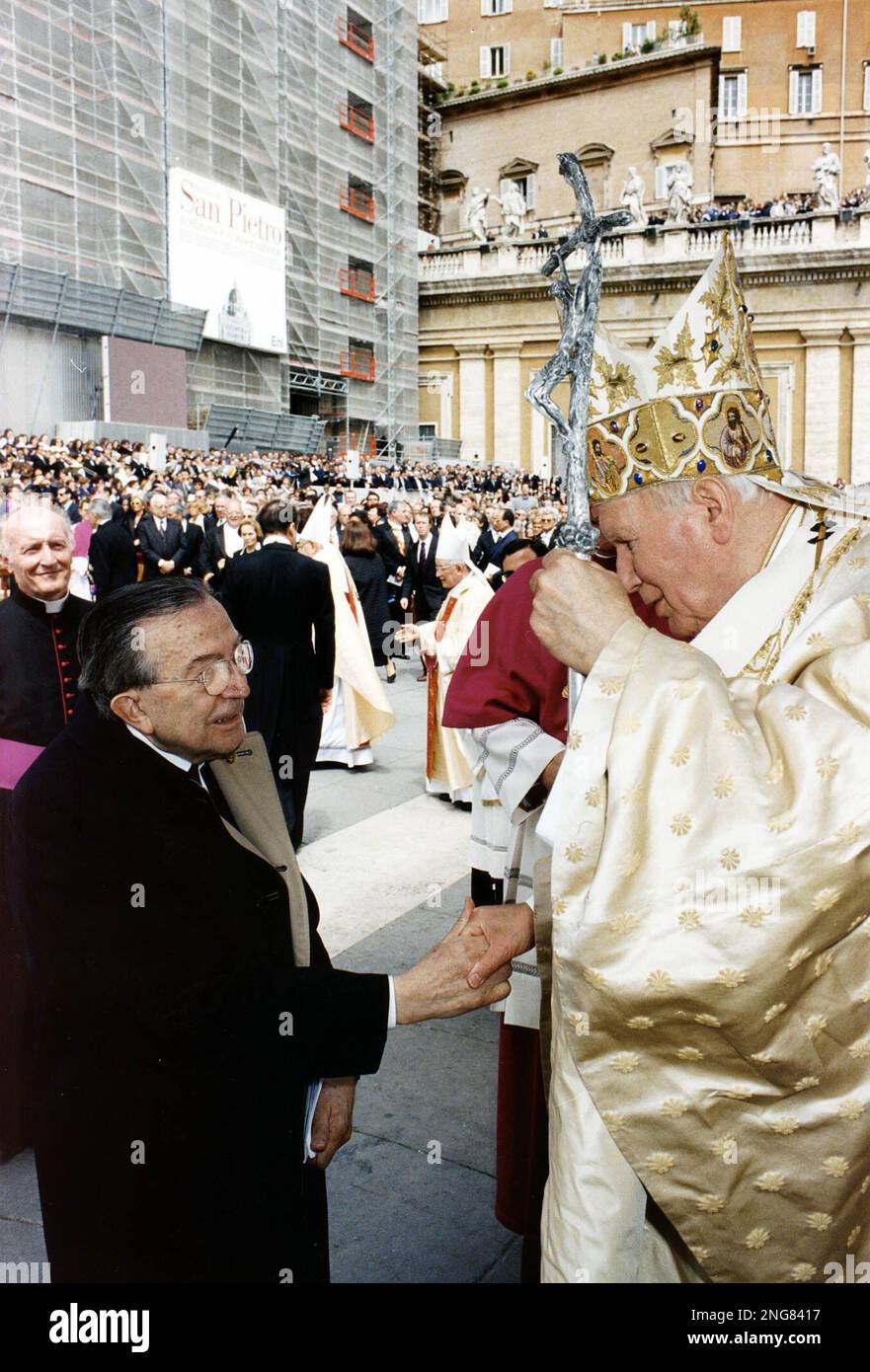FILE -- Pope John Paul II shakes hands with Italian former Premier ...