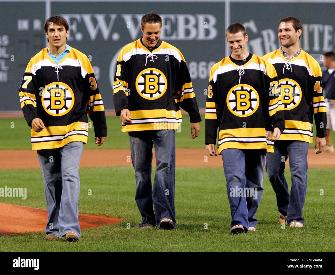 Boston Bruins players, from left, Patrice Bergeron, Andrew Alberts ...