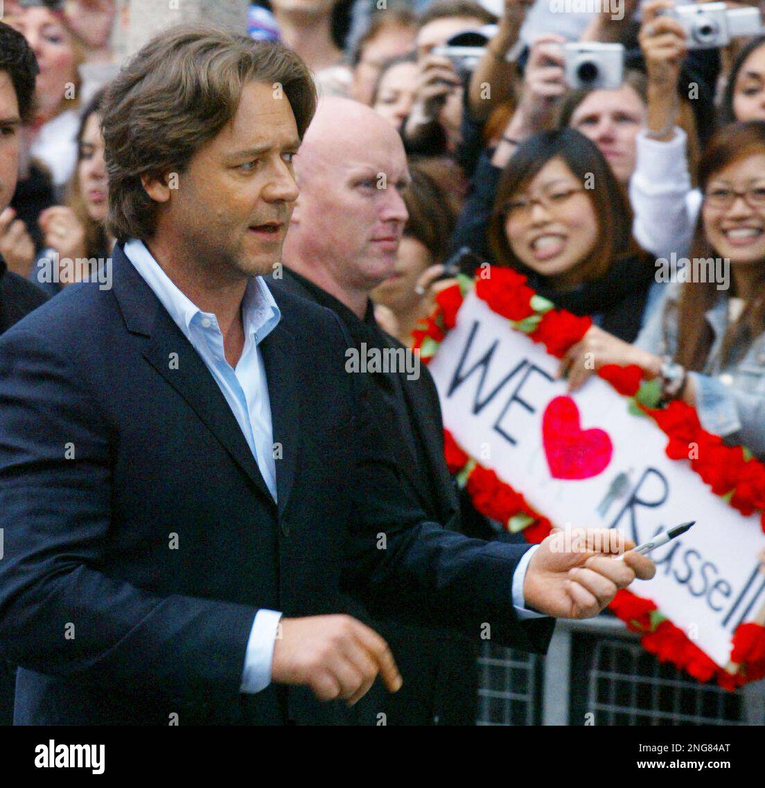 Actor Russell Crowe makes his way to sign autographs for fans as he ...