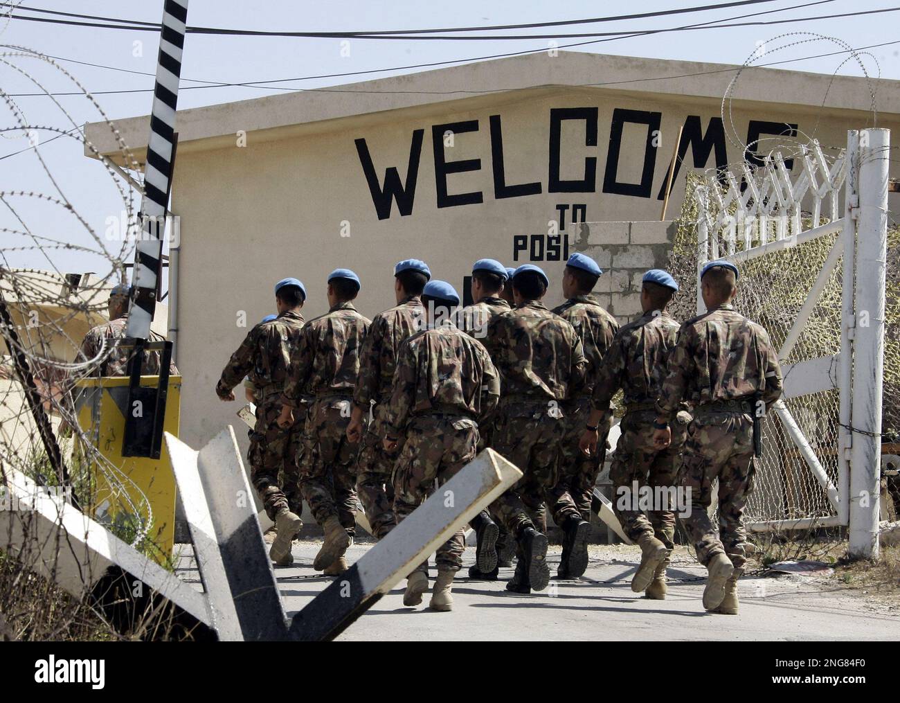 Italian UNIFIL soldiers enter their military base near Kalaway in the ...