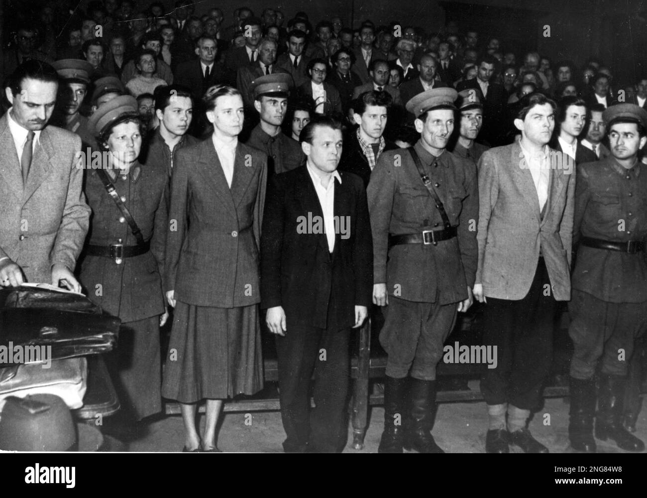 From left to right: unidentified man, unidentified uniformed woman ...