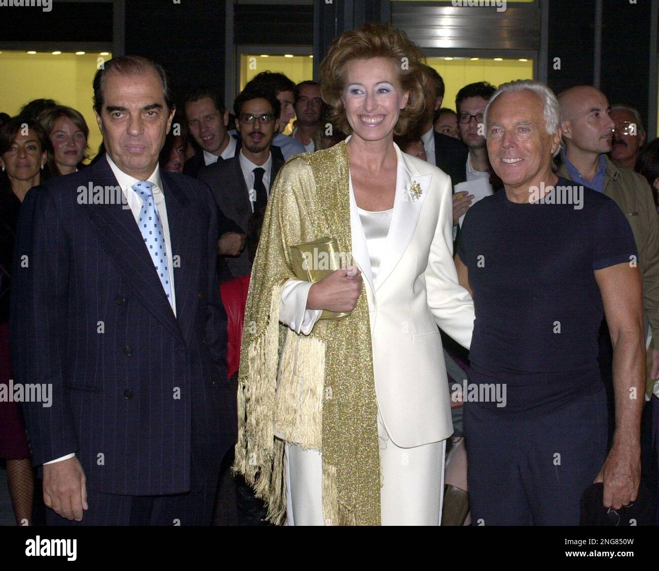 Italian stylist Giorgio Armani, at right, welcomes Italian ...
