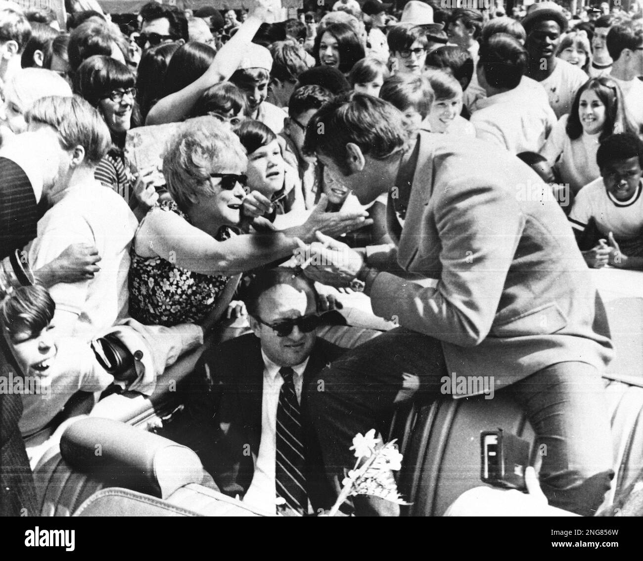 New York Jets' quarterback Joe Namath, right, is mobbed as he ...