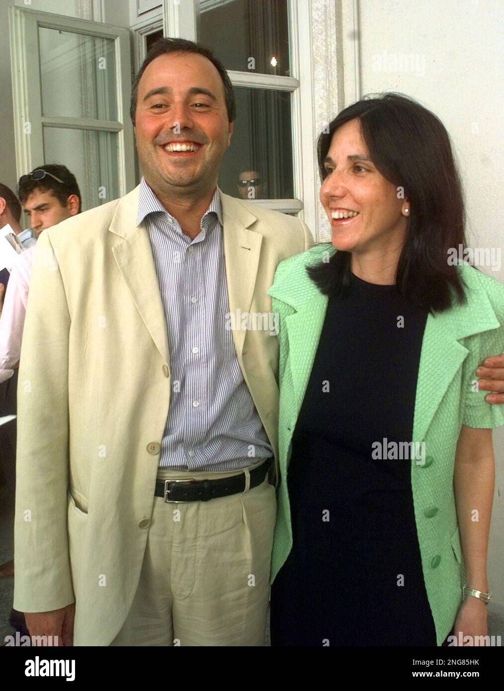 Alberto Alessio holds his wife Patrizia in his house in Turin, Italy ...