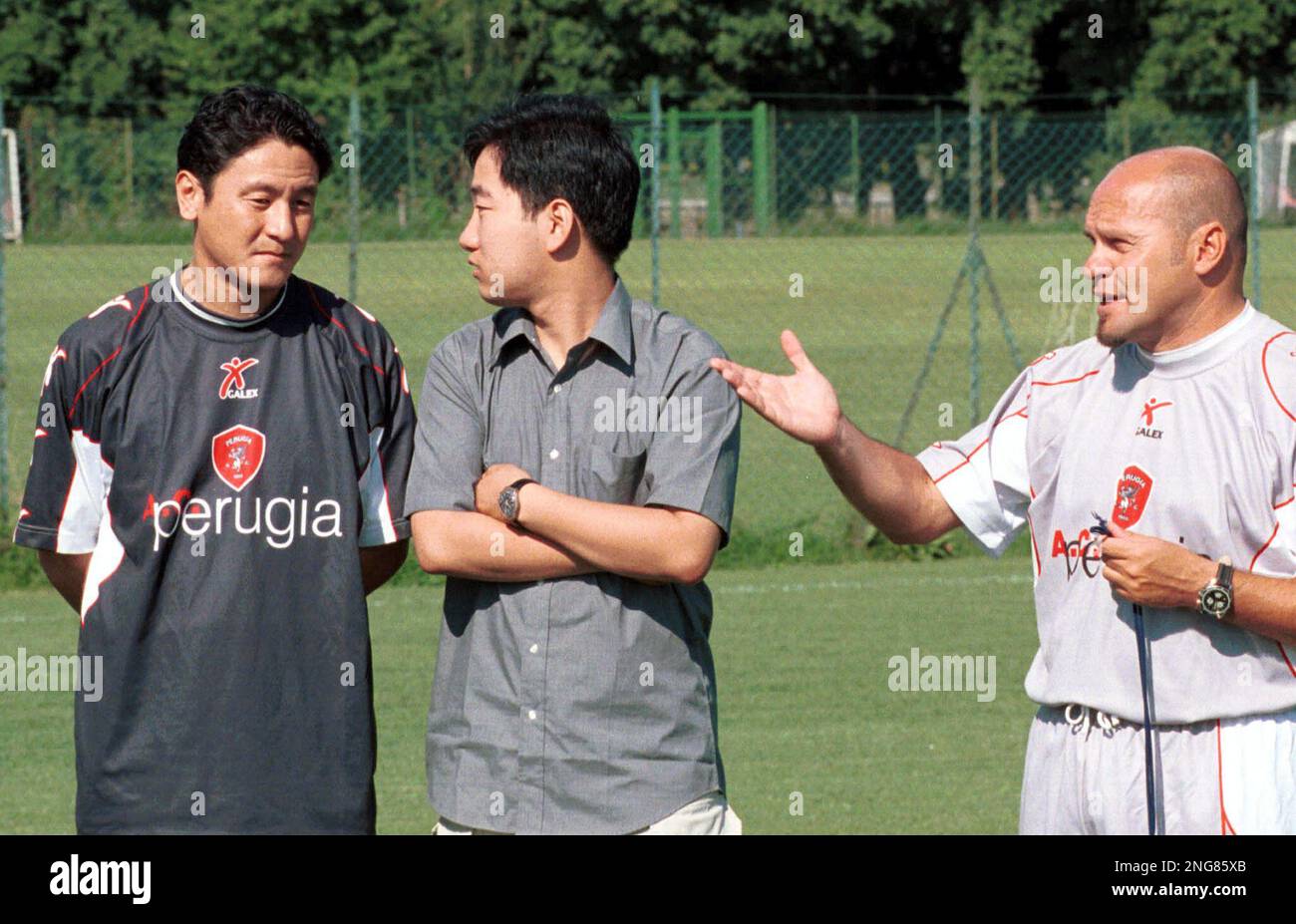Chinese soccer player Ma Ming Yu (left) talks to Perugia team trainer ...