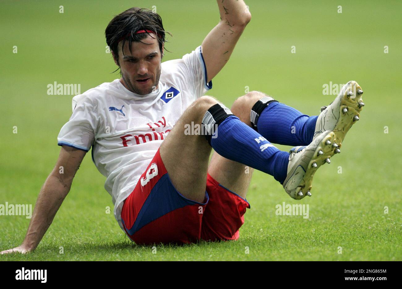 Hamburg's Raphael Wicky sits on the pitch during the German Bundesliga ...