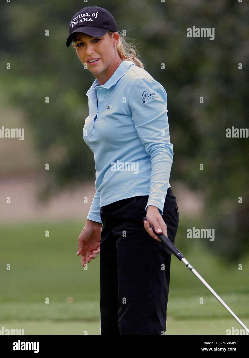 Cristie Kerr tries to coax her ball after putting on the 10th green ...